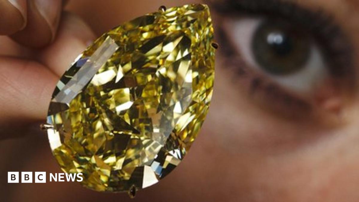 Yellow Sun-Drop diamond goes for $10.9m at Sotheby's - BBC News