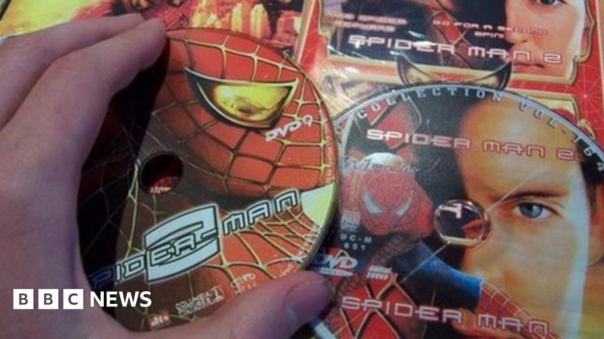 Arrests over 150,000 fake DVDs and CDs seized in Sussex - BBC News