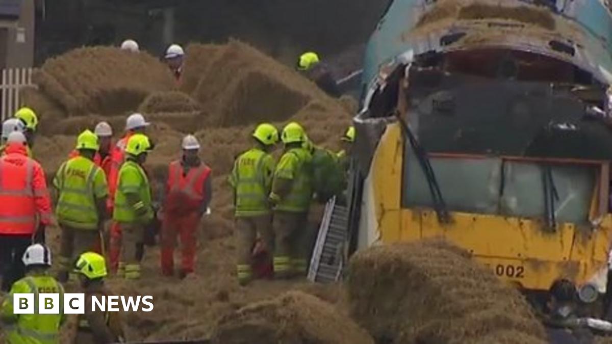Train and lorry collide on level crossing near Whitland - BBC News
