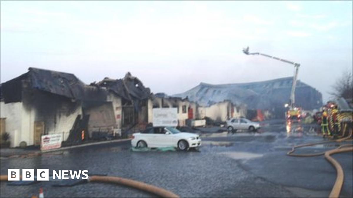 'Wood-burning stove caused' Carvers builders merchants fire - BBC News