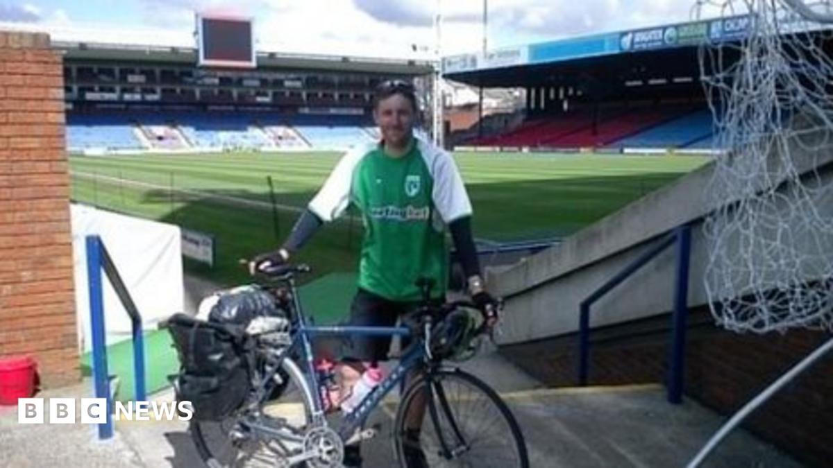 Guernsey cyclist James de la Rue completes charity challenge - BBC News