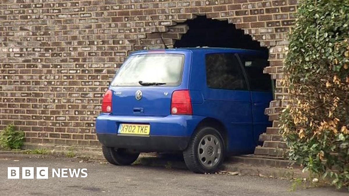 Driver crashes into garage wall in Peacehaven - BBC News