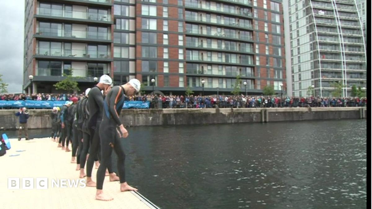 Great Manchester Swim: Thousands dip into Salford Quays - BBC News