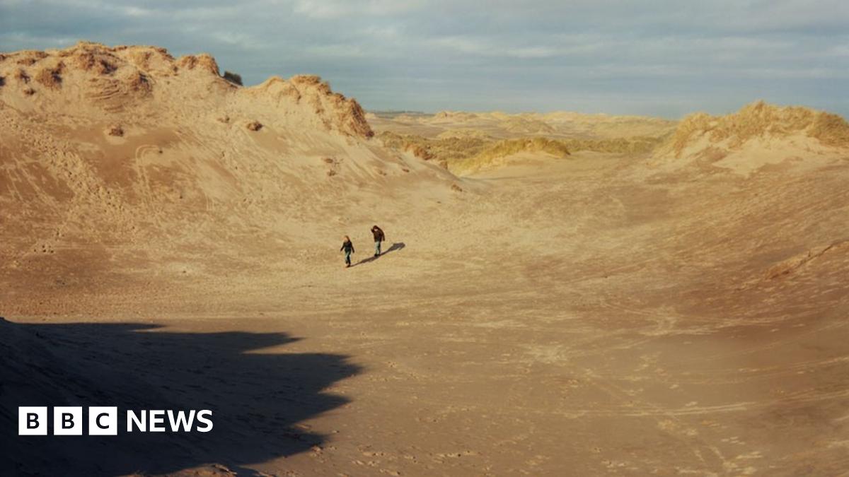 Two photographers focus on Menie - BBC News