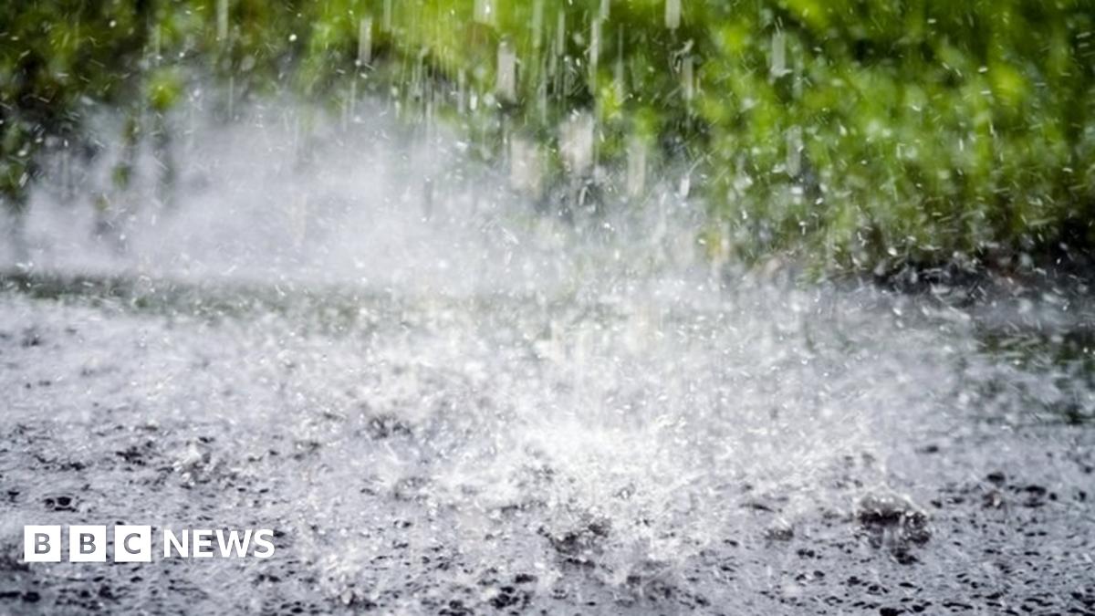 Landslide and flooding as heavy rain hits UK - BBC News