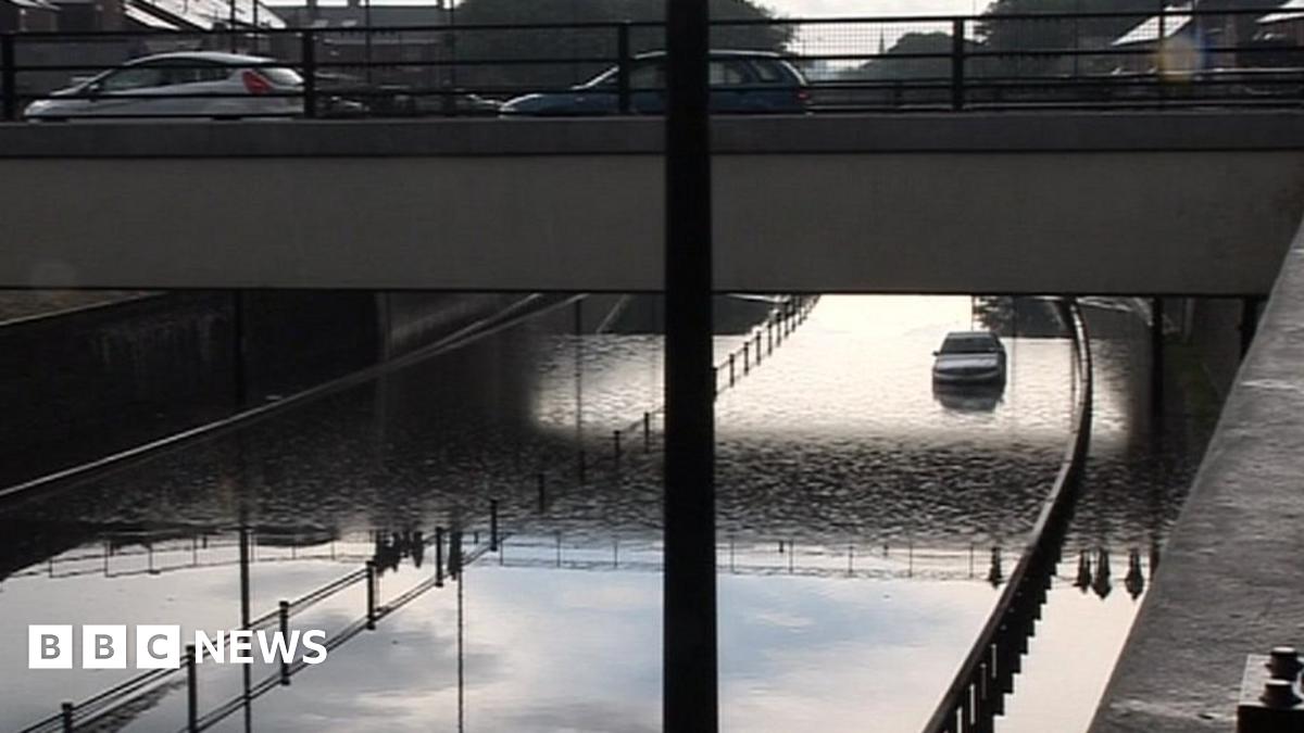 Newcastle floods lead to road closures and Metro delays - BBC News