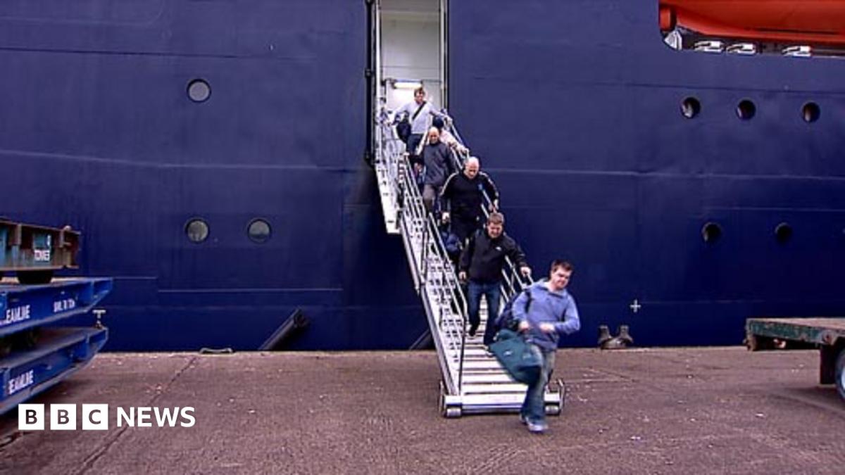 Stranded North Sea oil workers arrive ashore in Aberdeen - BBC News
