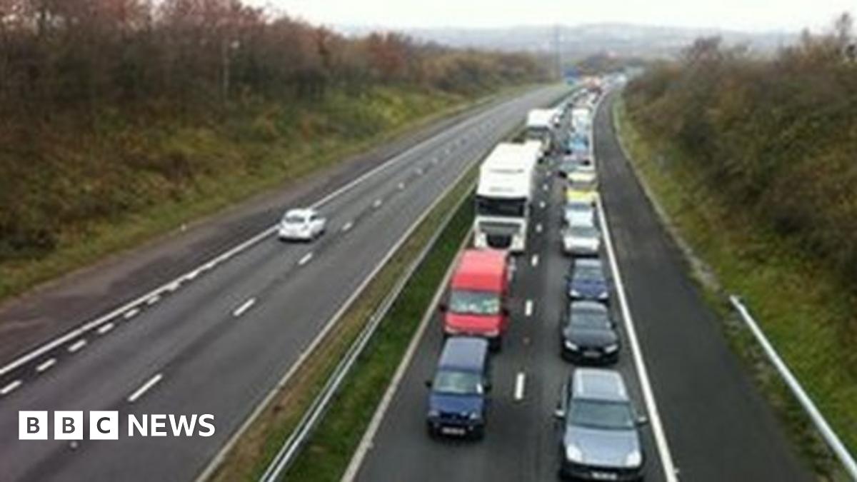M4 reopens after lorry overturns at junction 47 near Swansea - BBC News
