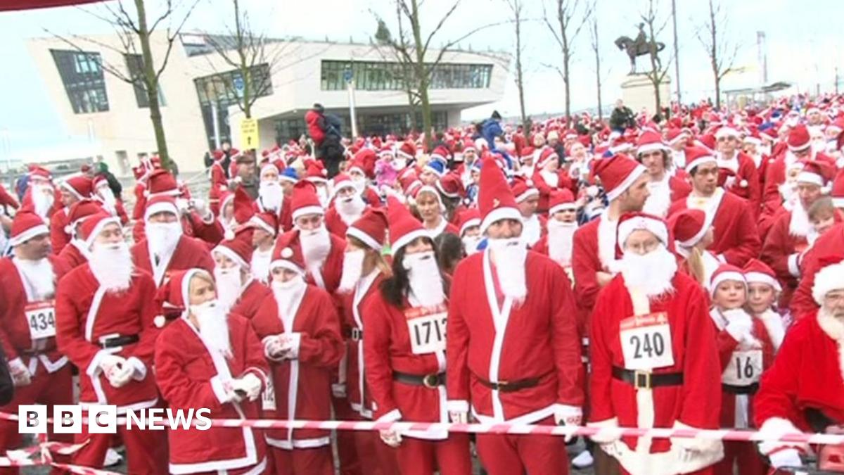 Liverpool Santa Dash: About 8,000 take part in fun run - BBC News