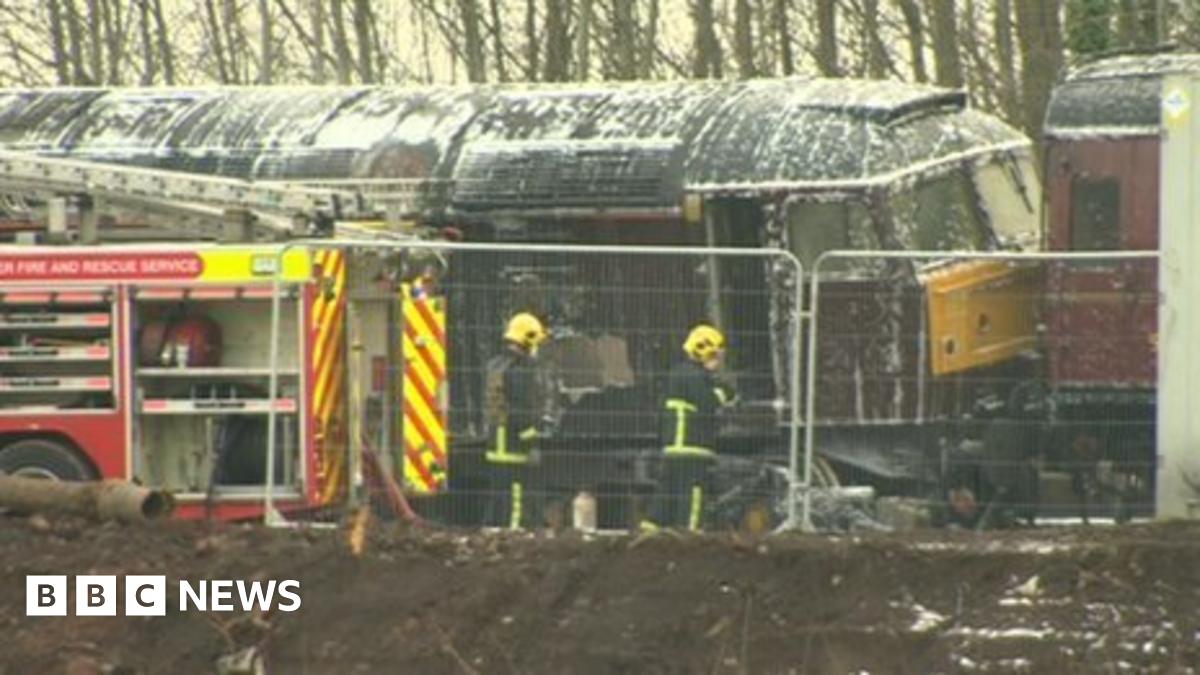 Train derails and catches fire in Salford - BBC News