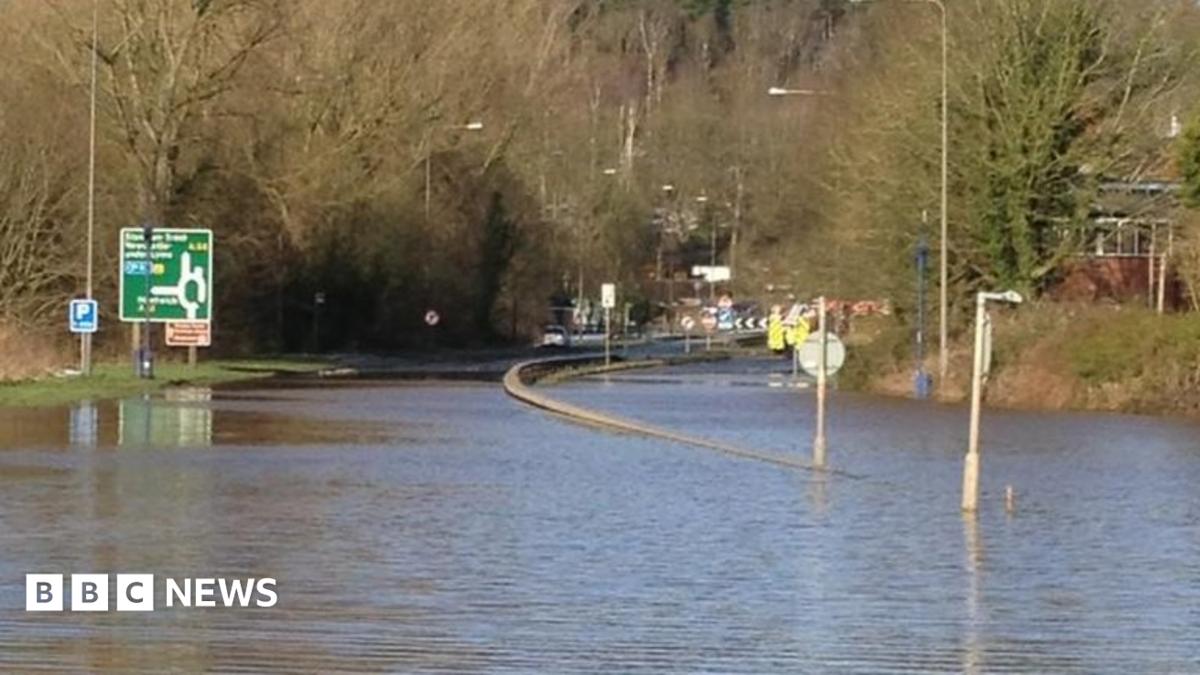 Woman rescued as flood closes A34 at Meaford - BBC News