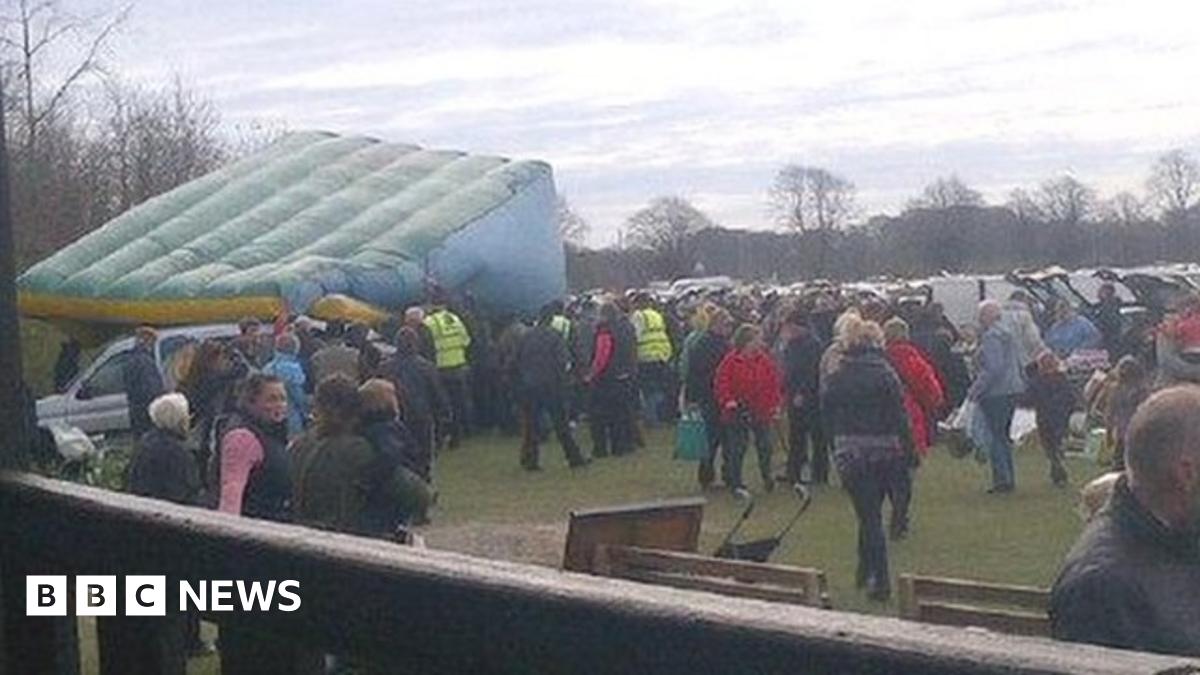 Harrogate inflatable slide blows over injuring five - BBC News