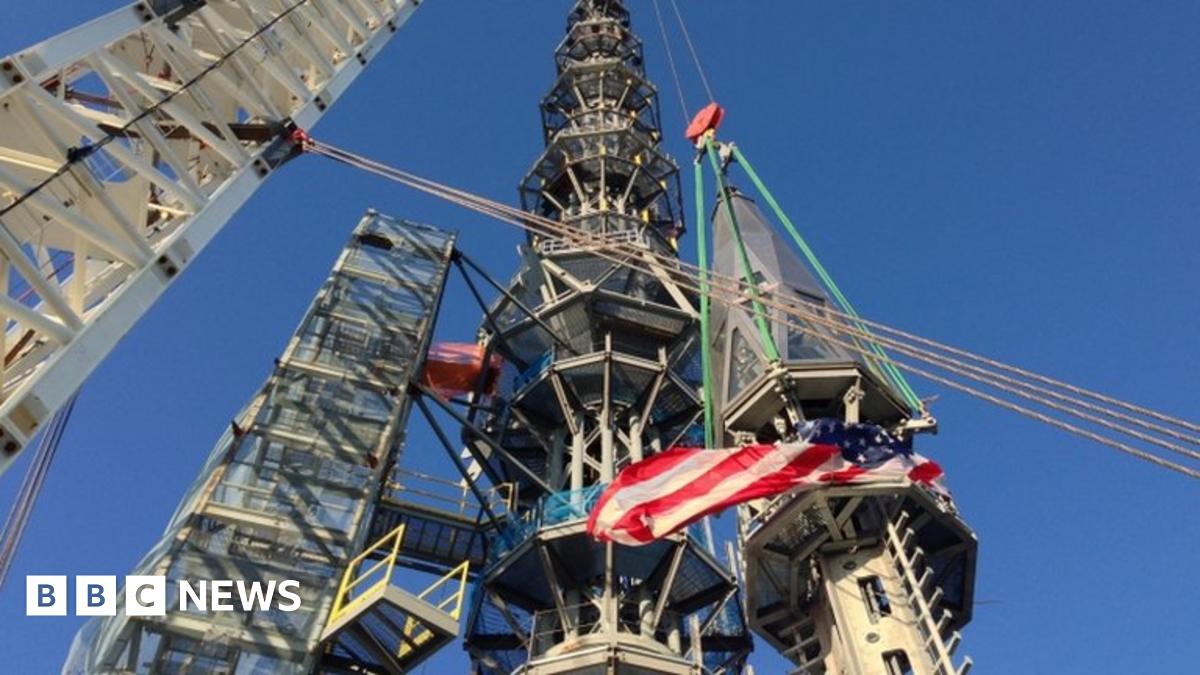 One World Trade Center spire installed in New York City - BBC News