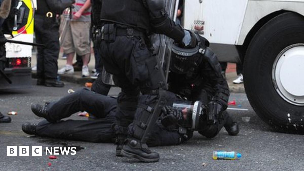 Belfast riots: 56 police officers injured during parade protests - BBC News