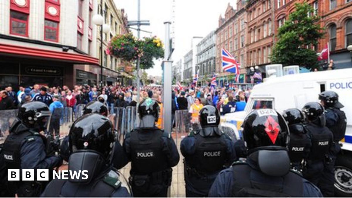Six men charged after Belfast riots - BBC News