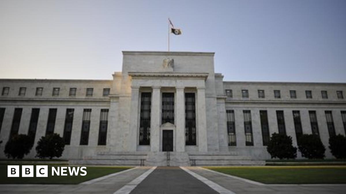 Shares at record high as Federal Reserve refrains from tapering - BBC News
