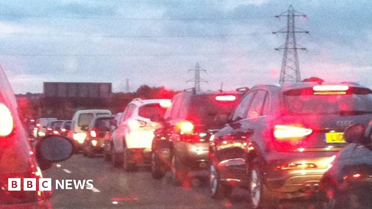 Four arrests in west Belfast over M1 motorway alert - BBC News