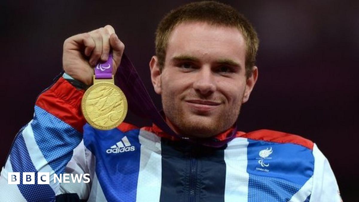 Paralympian Mickey Bushell collects MBE - BBC News