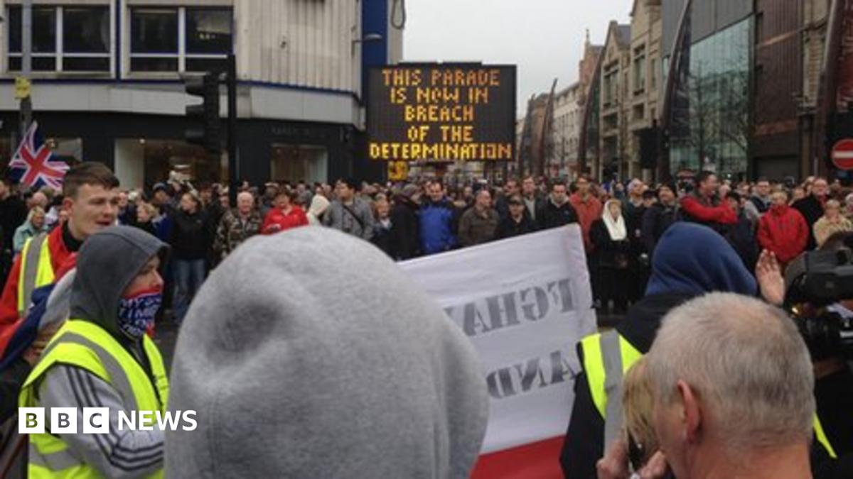 Police injured during loyalist protest march in Belfast - BBC News