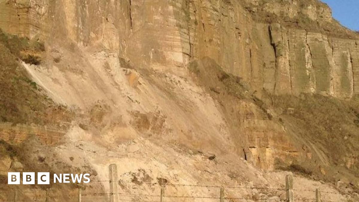 Part of cliff collapses into sea at Rock-a-Nore - BBC News