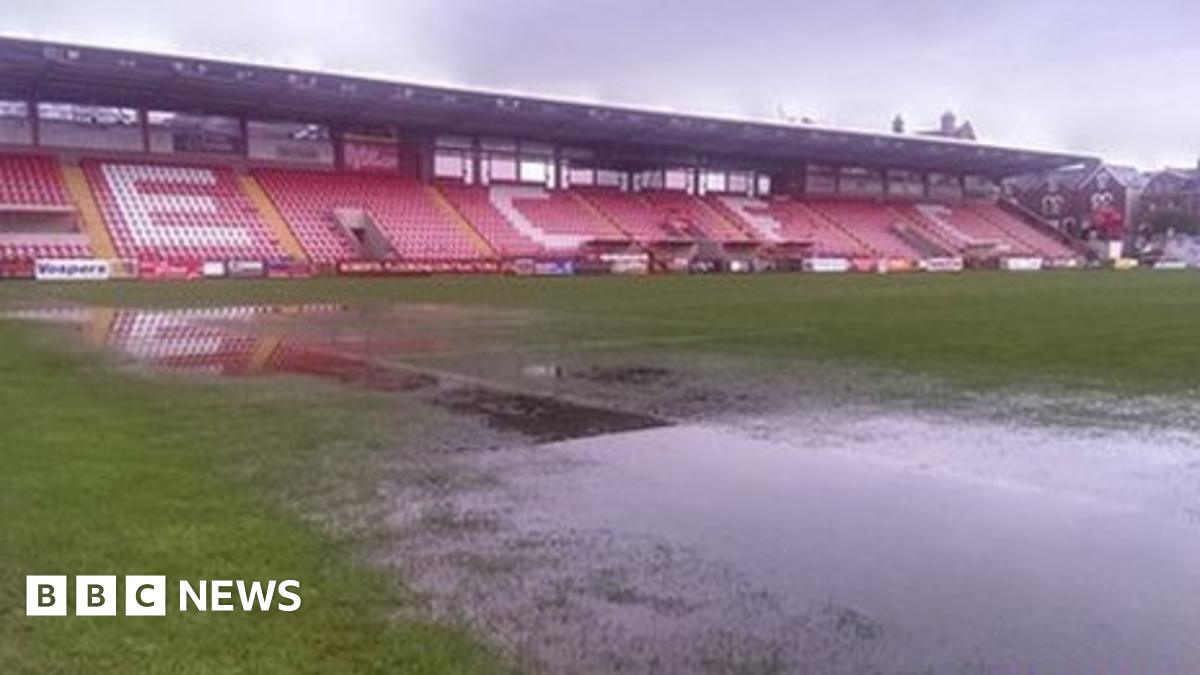 Devon woman stuck in mud amid downpours - BBC News