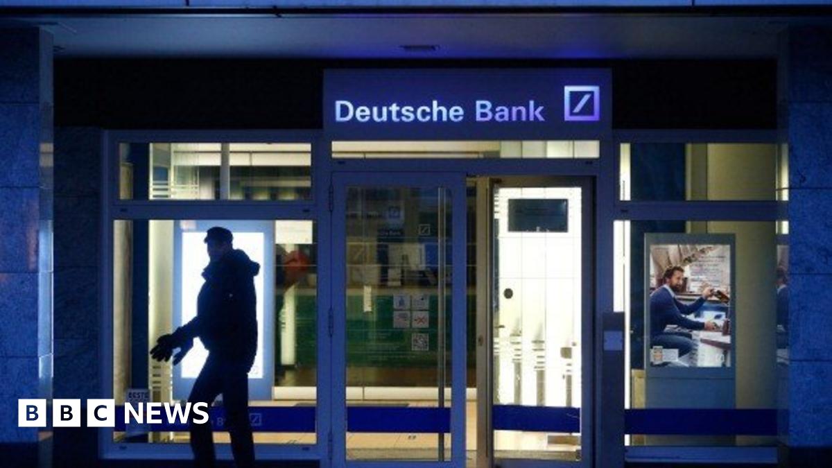 Deutsche Bank stock hit after it reports surprise loss - BBC News