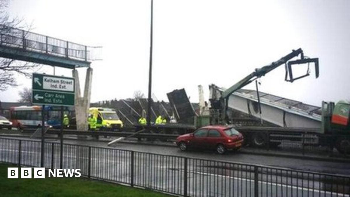 Doncaster footbridge collapses after being hit by crane on lorry - BBC News