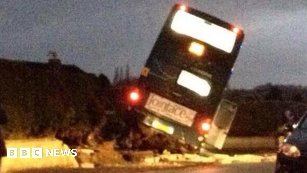 Double decker bus crashes into Kippax garden wall - BBC News