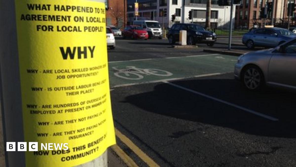 Row over 'racist' posters in Belfast - BBC News