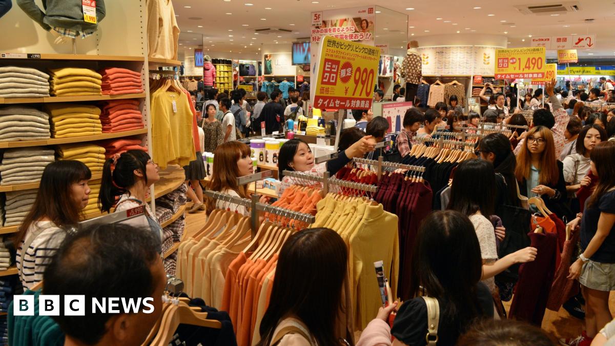 Japan retail sales surge on tax hike - BBC News