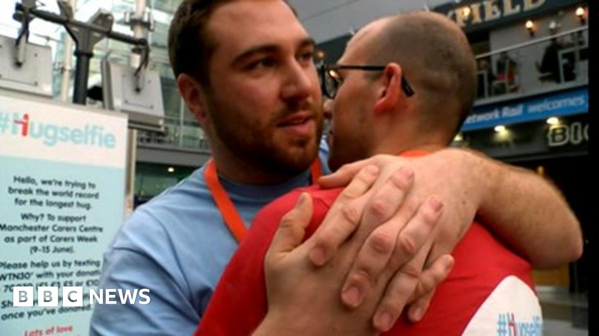Workmates embrace longest hugging record - BBC News