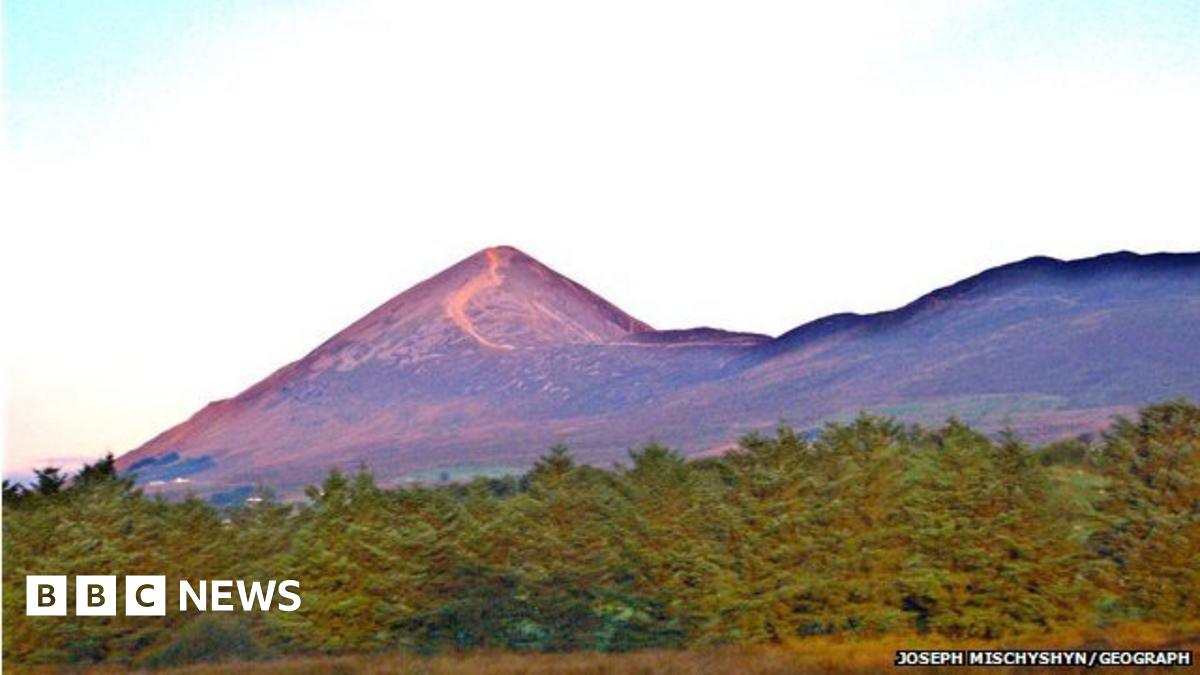 Thousands scale Croagh Patrick in Irish holy mountain climb - BBC News