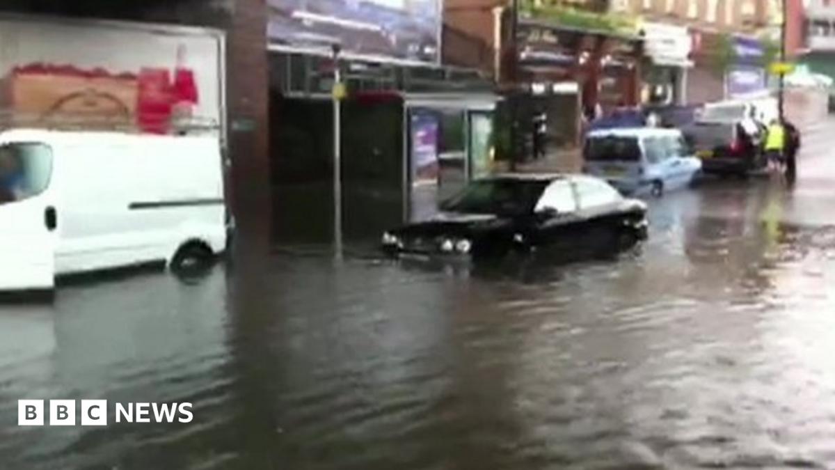 Women rescued from car in north-west London flash floods - BBC News
