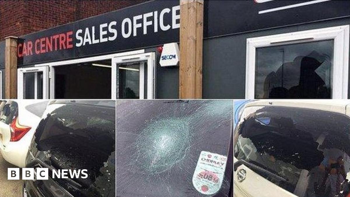 Wigan showroom vandals smash 70 windows with sledgehammer - BBC News