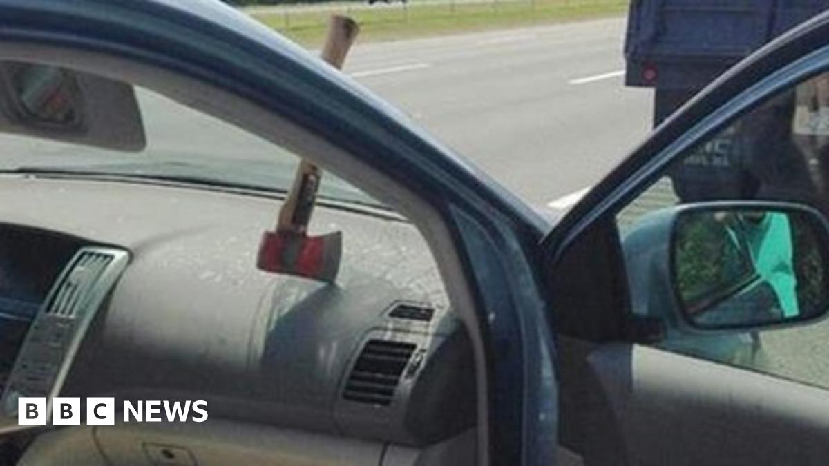 Axe crashes through driver's window - BBC News
