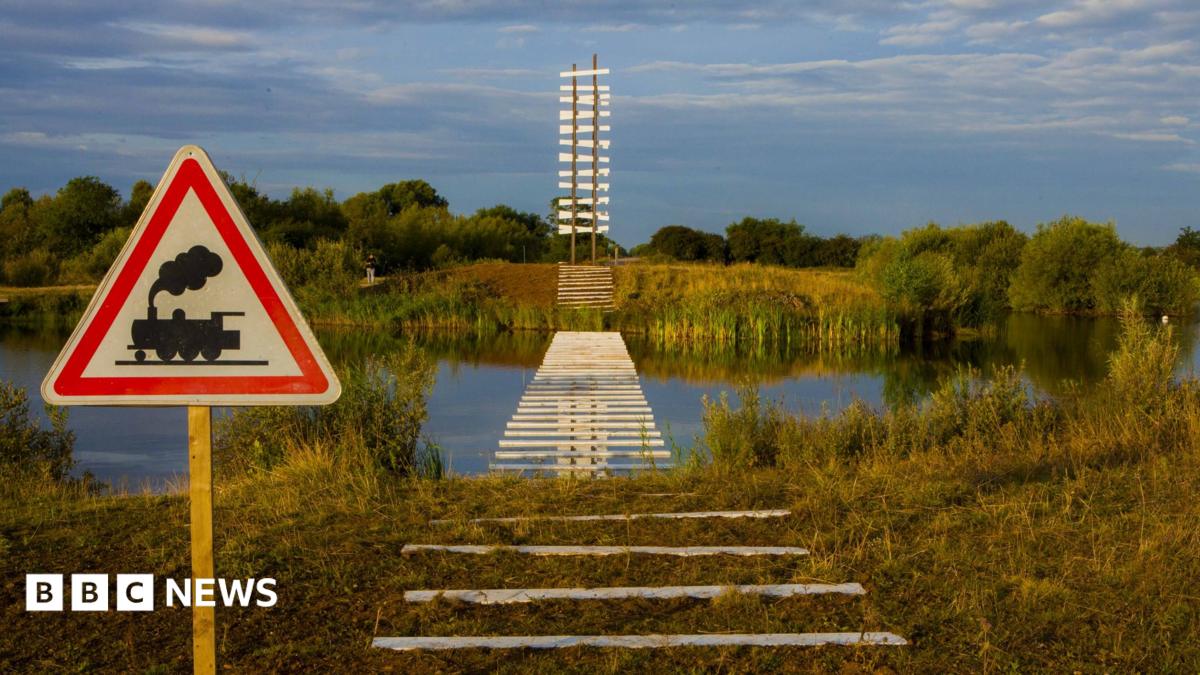 Changing Tracks railway line towers over Stanwick Lakes - BBC News