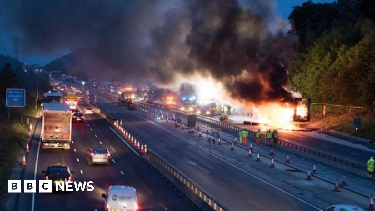 M25 closed after lorry fire damages road surface in Essex - BBC News