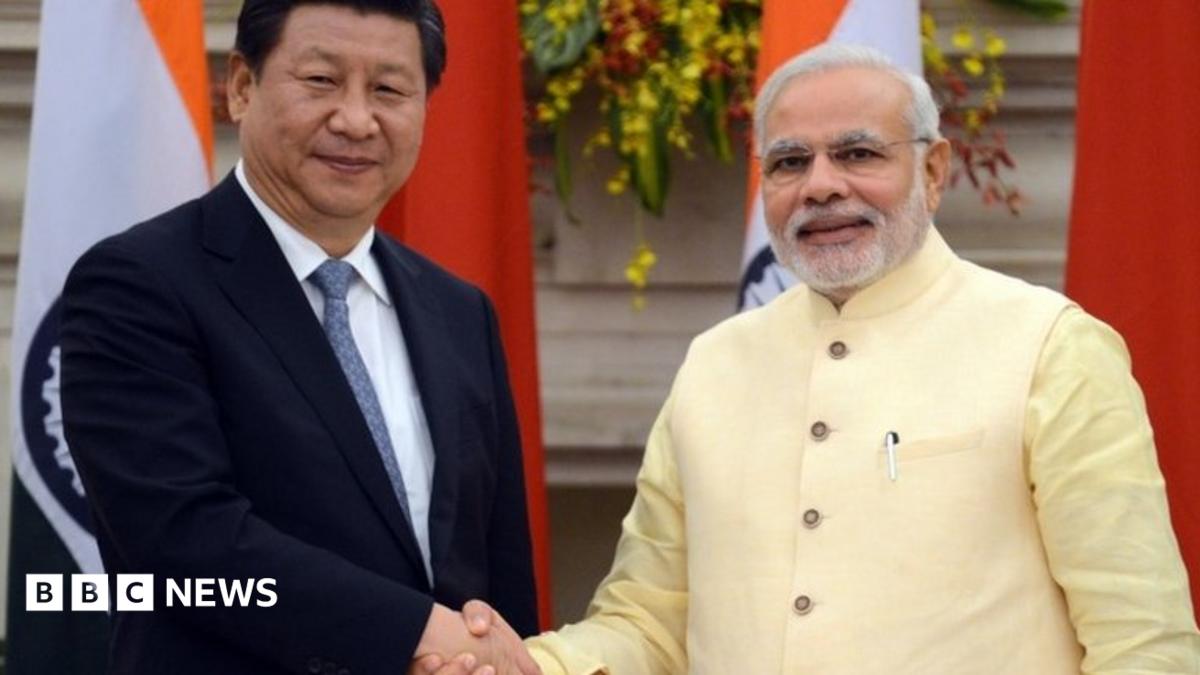 China's Xi Jinping signs landmark deals on India visit - BBC News