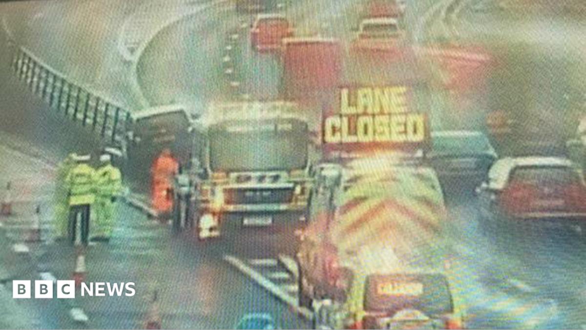 Car crashes and mounts central barrier on M8 motorway - BBC News