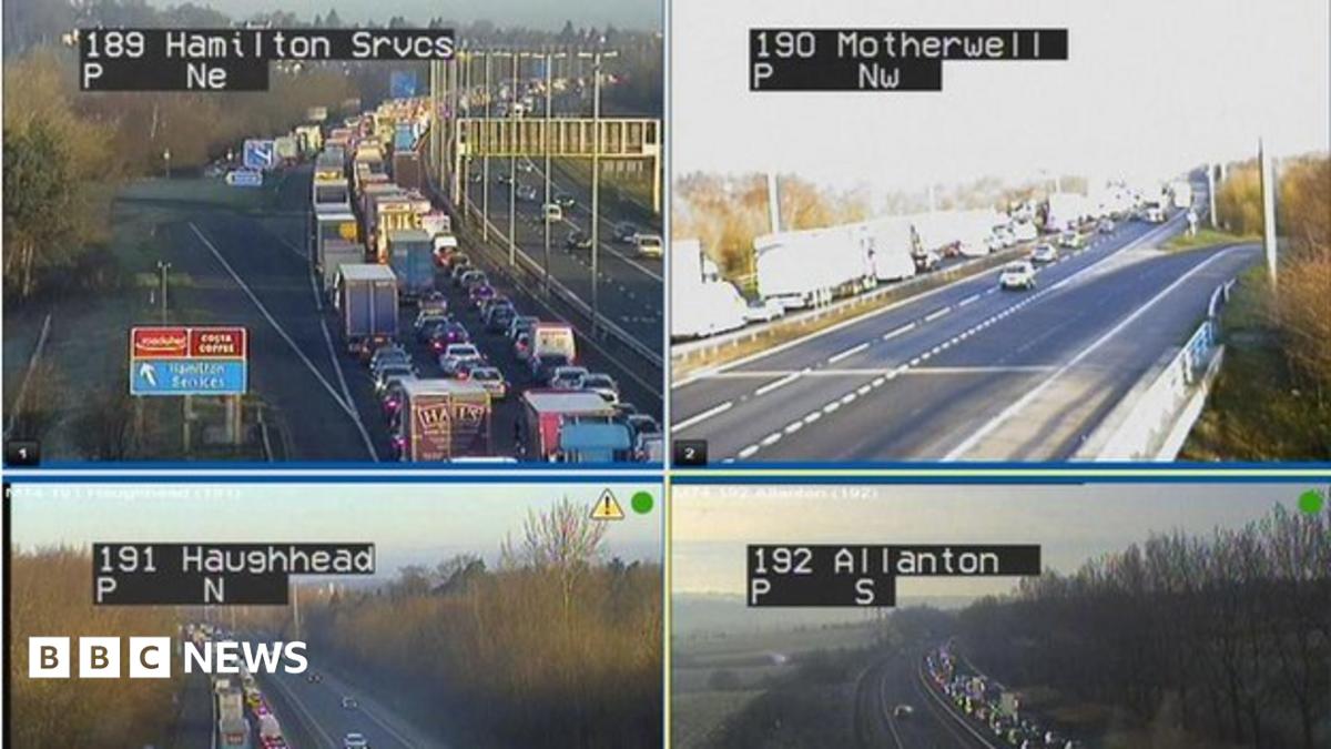 Driver hurt and travel delays as lorries crash on M74 motorway - BBC News