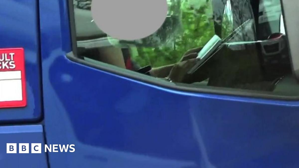 Lorry driver filmed reading book while driving along M60 - BBC News