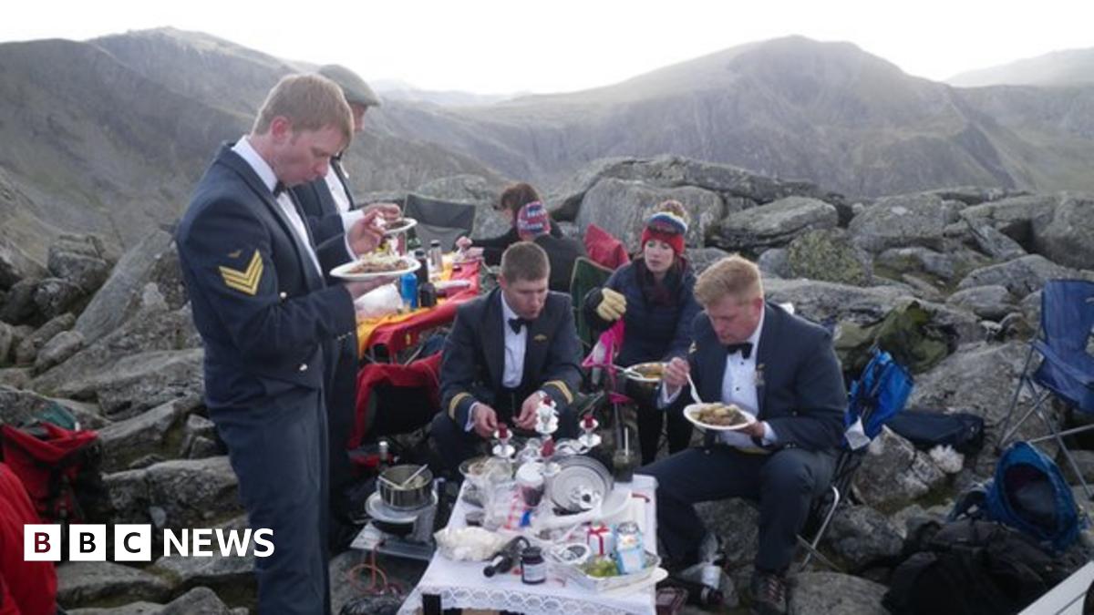 RAF and rescue team enjoy 'extreme dine' on mountain top - BBC News