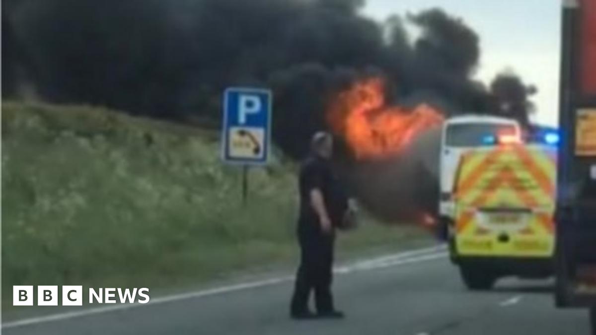 Coach fire causes traffic tailbacks on A55 near Holywell - BBC News