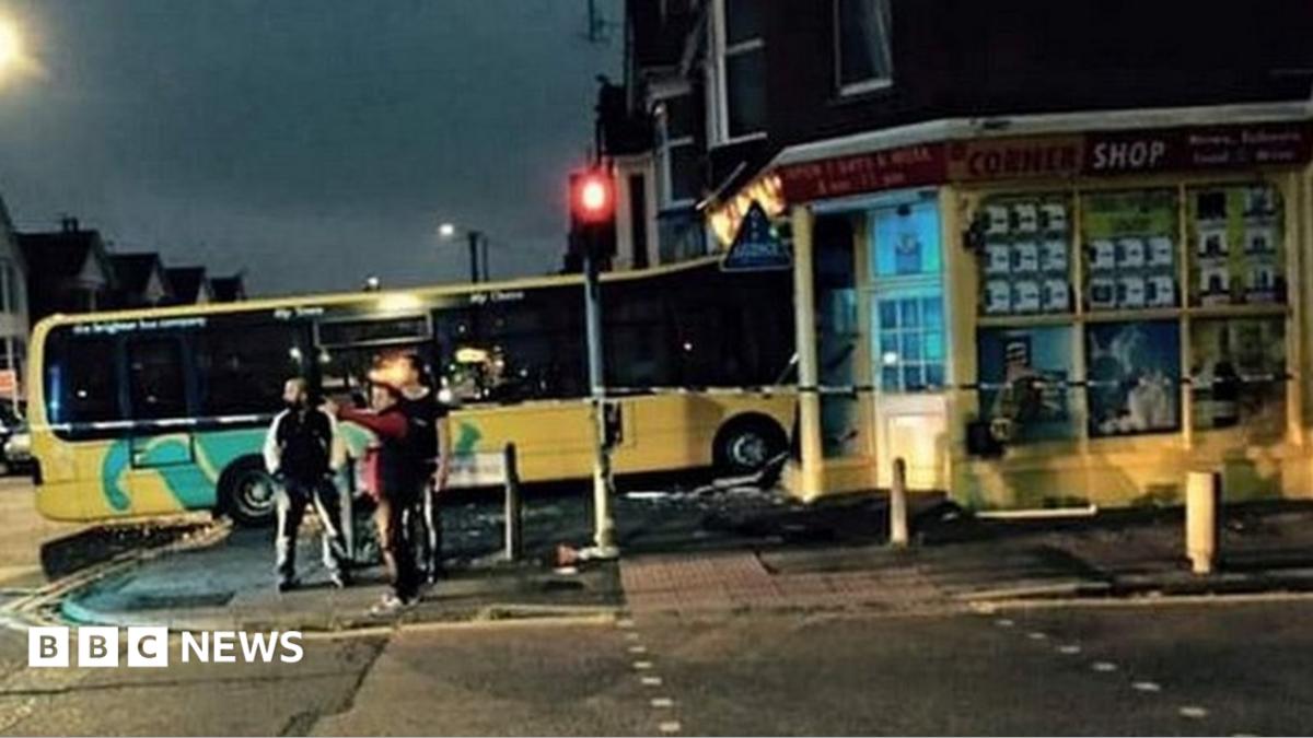 Bus crashes through Bournemouth shop window - BBC News
