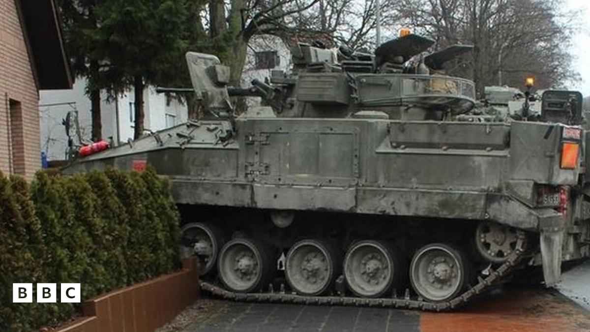 British tank crashes into garden fence in Germany - BBC Newsround