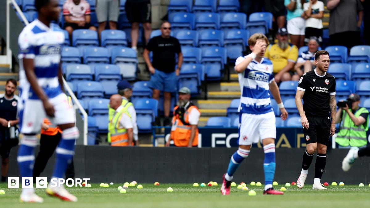 Reading supporters throw tennis balls onto the pitch during Bolton game ...