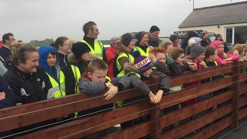 Golden plane makes special flight on Orkney anniversary - BBC News