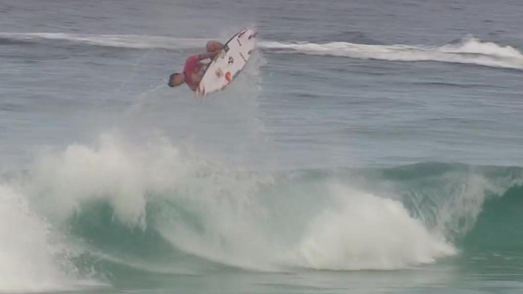 Watch this surfer perform an epic backflip over a wave - BBC Newsround