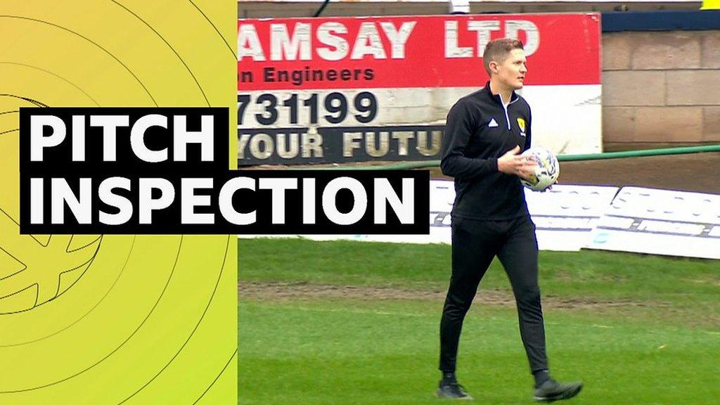 Dundee v Motherwell: Referee David Dickinson carries out pitch ...