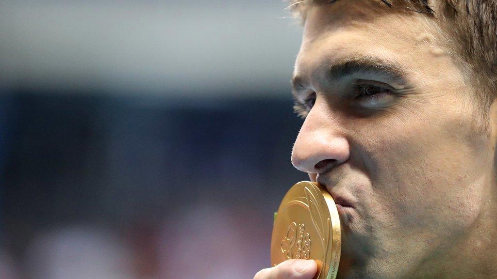 Michael Phelps wins 20th and 21st gold medals - BBC Newsround